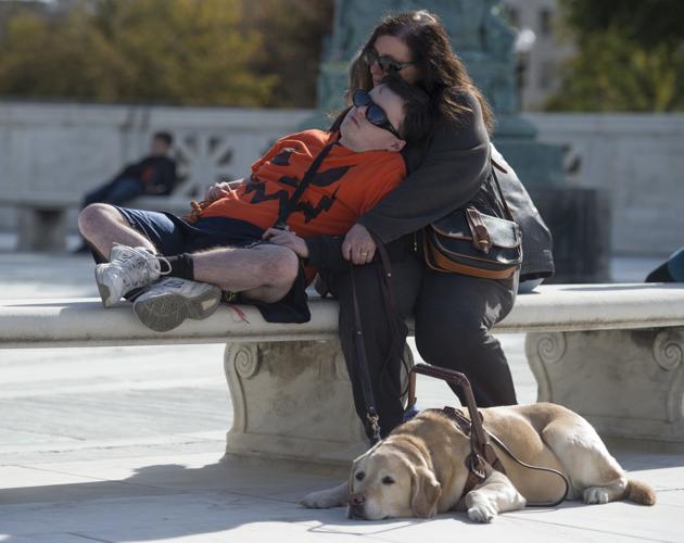 Photos: Service dogs head to the Supreme Court