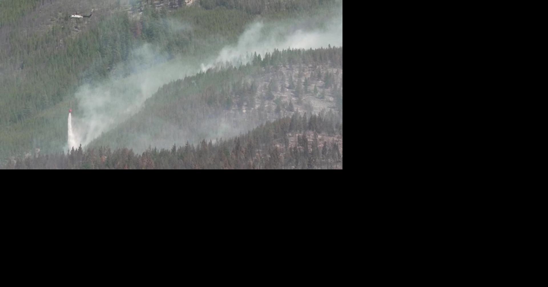 RAW: CAN: BC WILDFIRES/HELICOPTERS DROP WATER