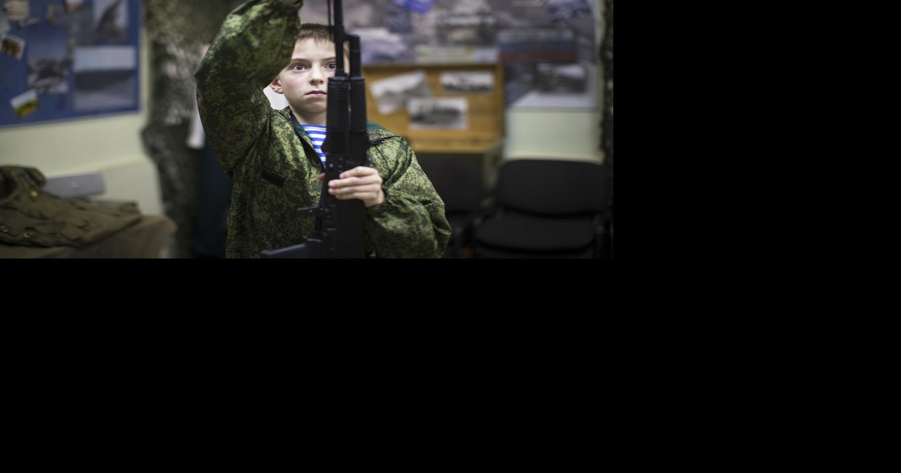 Photos: It's reading, writing and rifles for these Russian youths