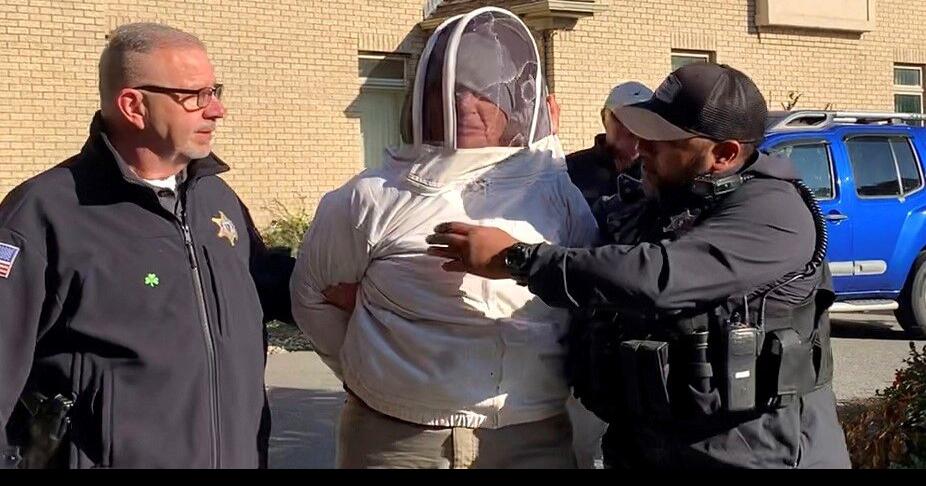 Woman charged with unleashing swarm of bees on deputies at eviction