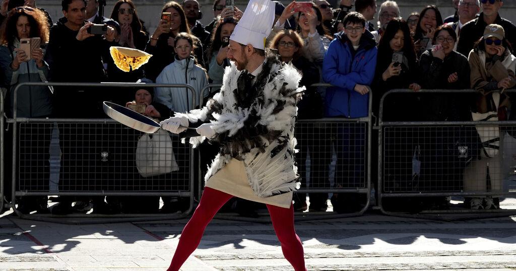 Photos: Frying pan race marks annual Pancake Day in London