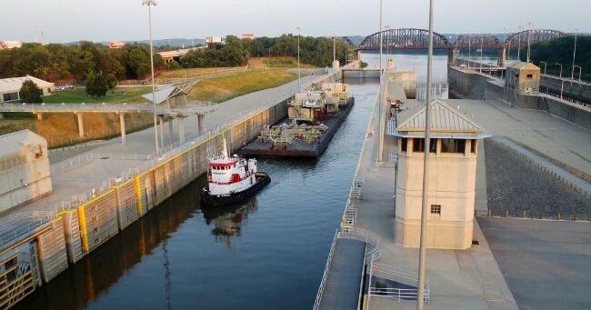 Barge carrying methanol lodged on McAlpine Dam after others break free ...