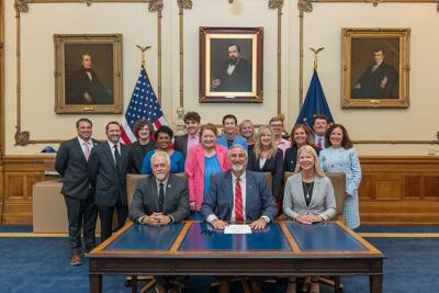 Governor ceremonially signs into law Negele's bill to improve breast ...