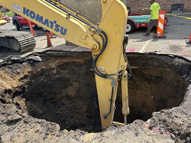 Sinkhole opens outside downtown Springfield office building | Local ...