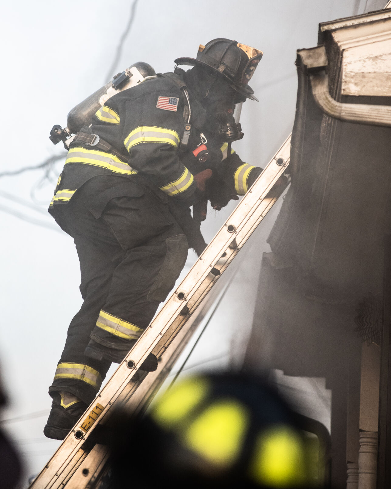 Firefighter rescued from ridge of roof during Springfield house fire ...