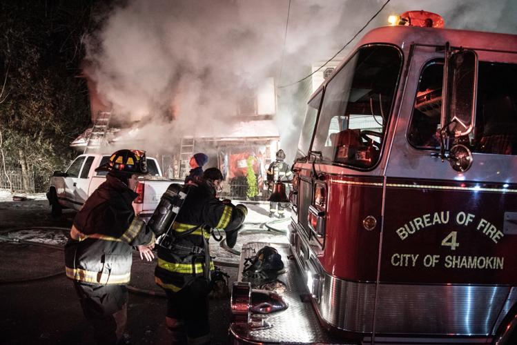 Firefighters contend with smoke, ice and hoarding conditions during ...