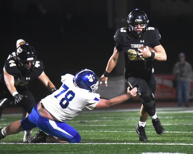 H.S. Football: Tigers pile on early, cruise to quarterfinal win ...