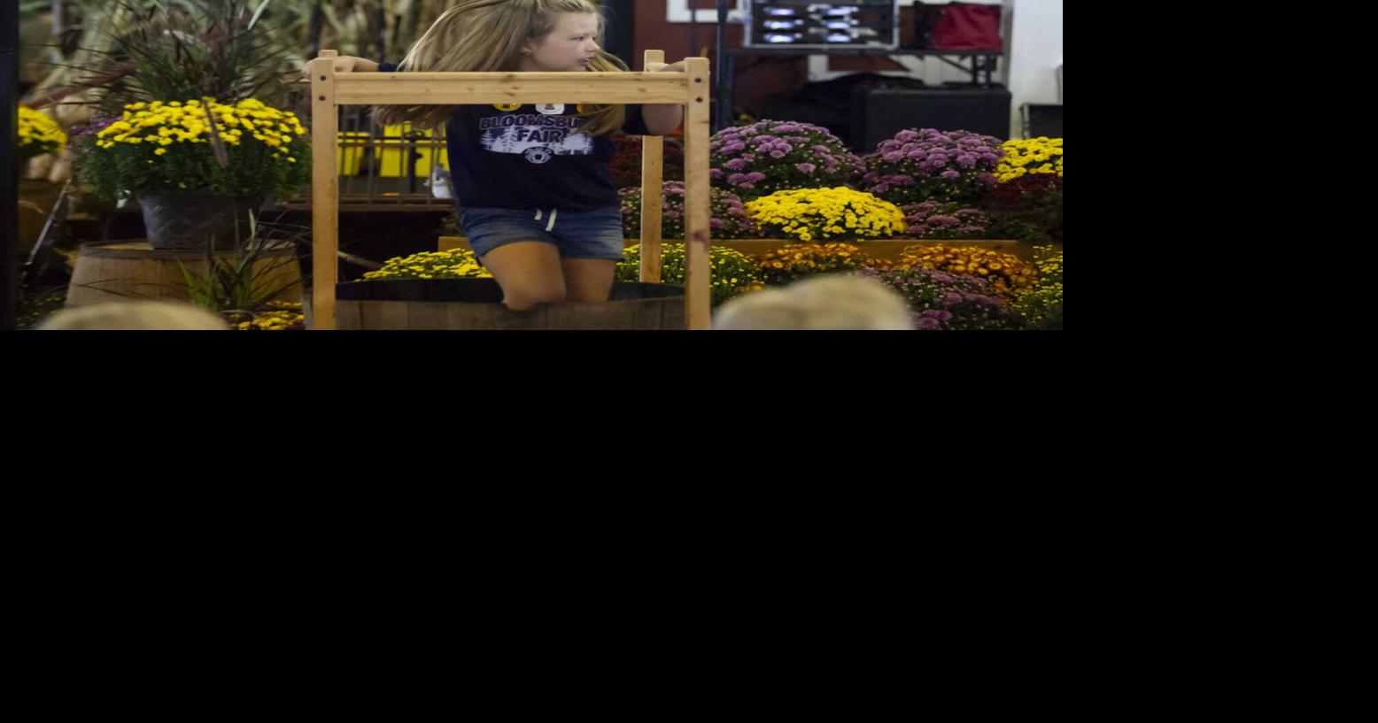 Father and daughter compete head-to-head in Bloomsburg Fair grape stomp ...