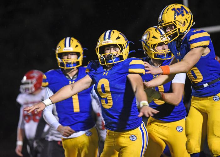 H.S. Football: Eagles prevail in rain to earn first district ...