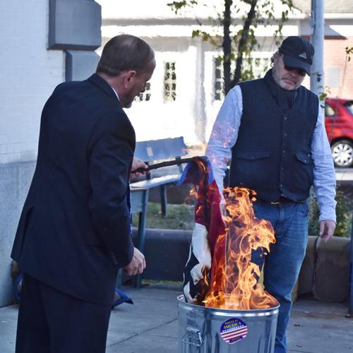 Activist burns Nazi/Confederate flag | Local | newsitem.com