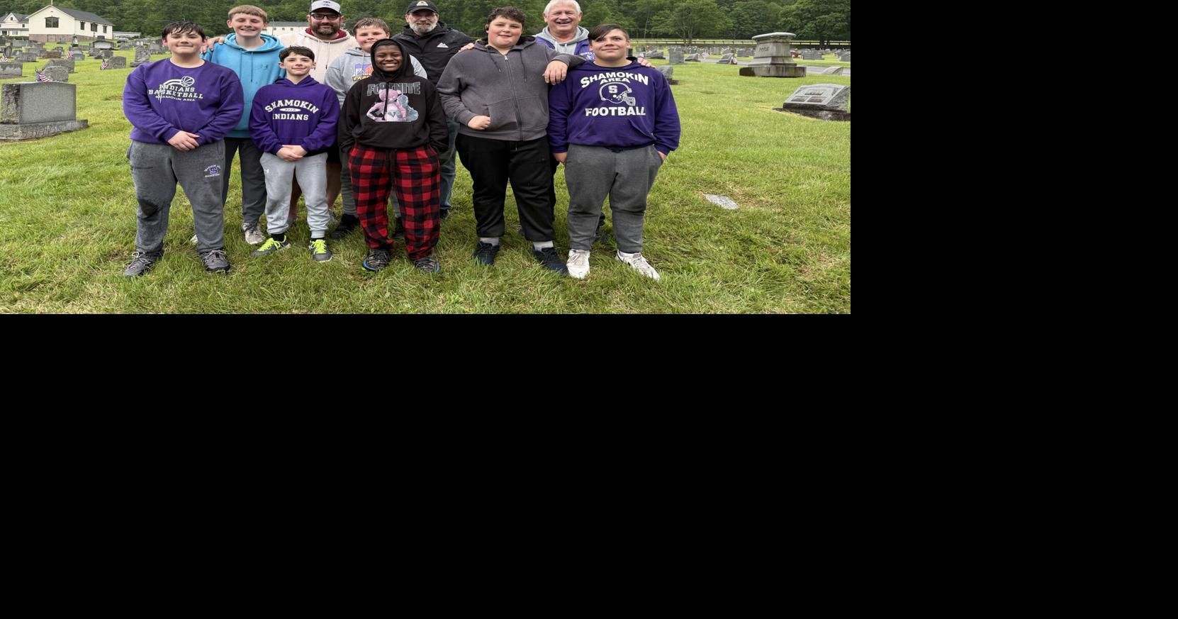Football players place flags at Odd Fellows Cemetery | Local | newsitem.com