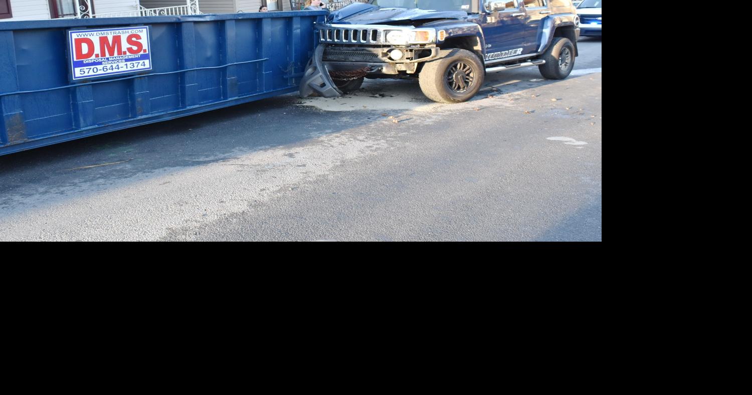 Three escape injury when Hummer crashes into dumpster on Race Street ...