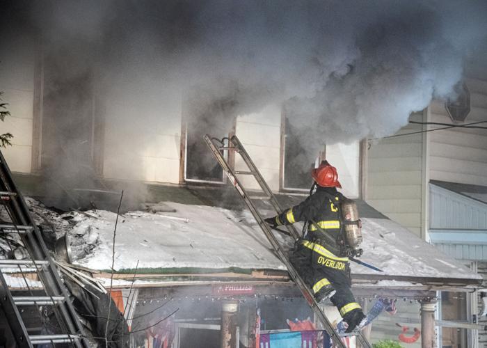 Firefighters contend with smoke, ice and hoarding conditions during ...