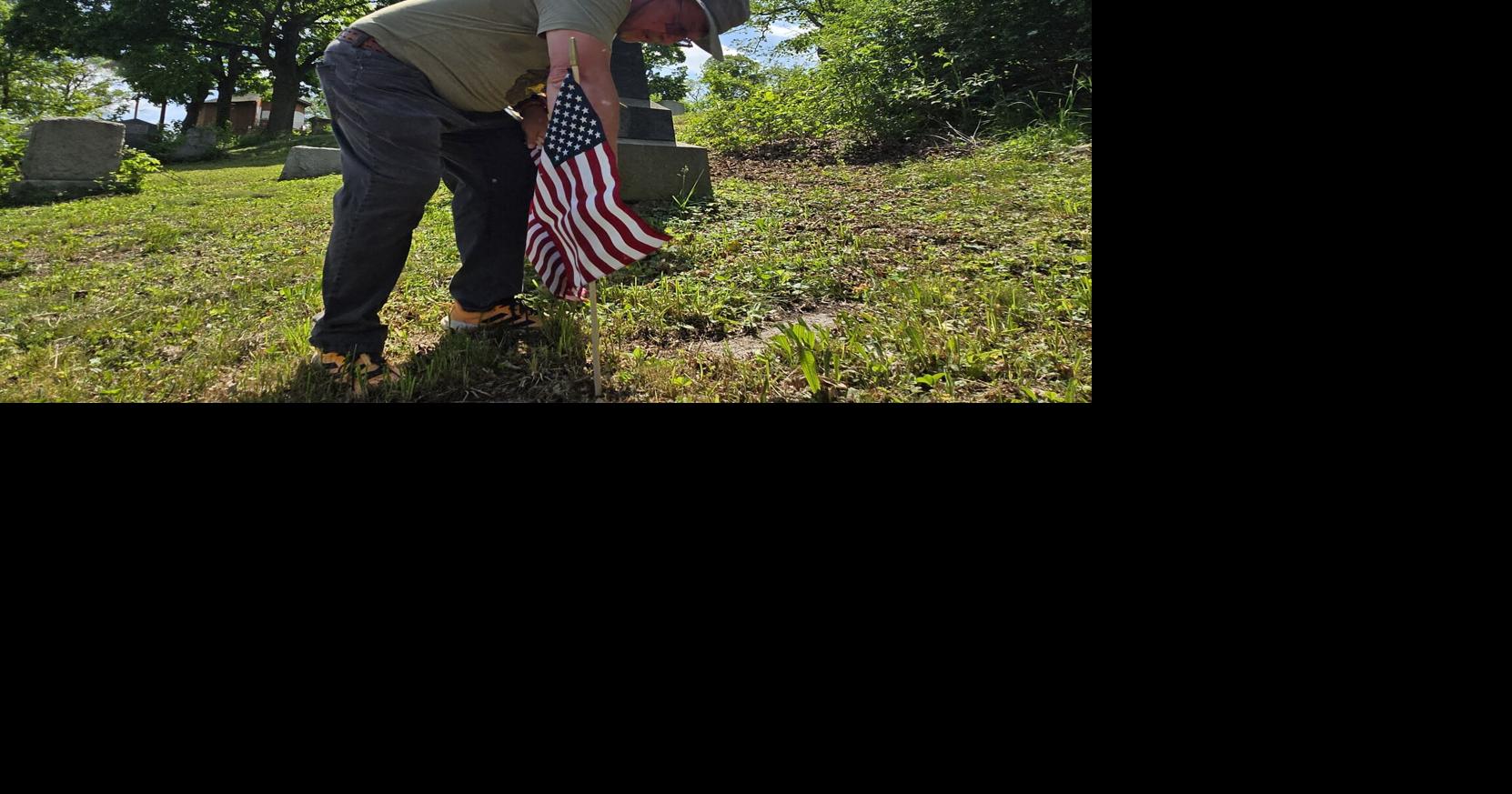 Veterans plant flags on service members' graves for Memorial Day ...
