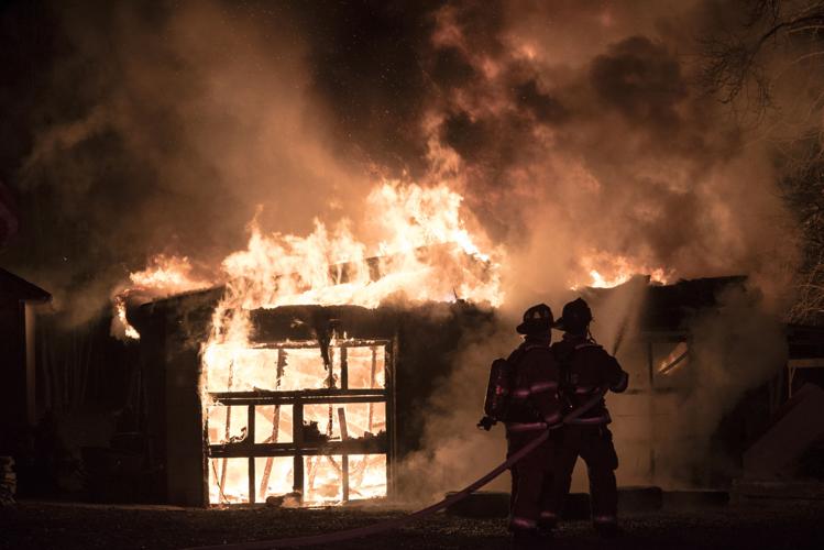 Fire destroys garage as heat from wood burner ignites paint thinner ...