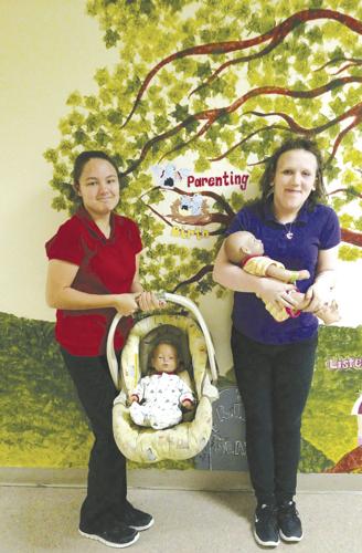 Students learn parenting skills with Real Care Baby lessons | Local ...