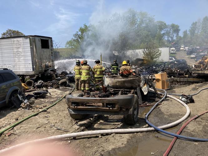 Salvage materials catch fire along Route 61; firefighters pressed into ...