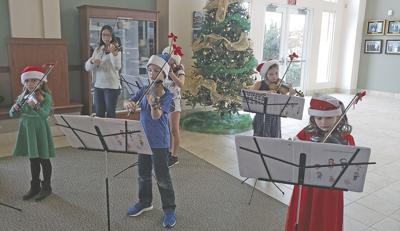 Mini orchestra treats guests to Christmas performance | Local News ...