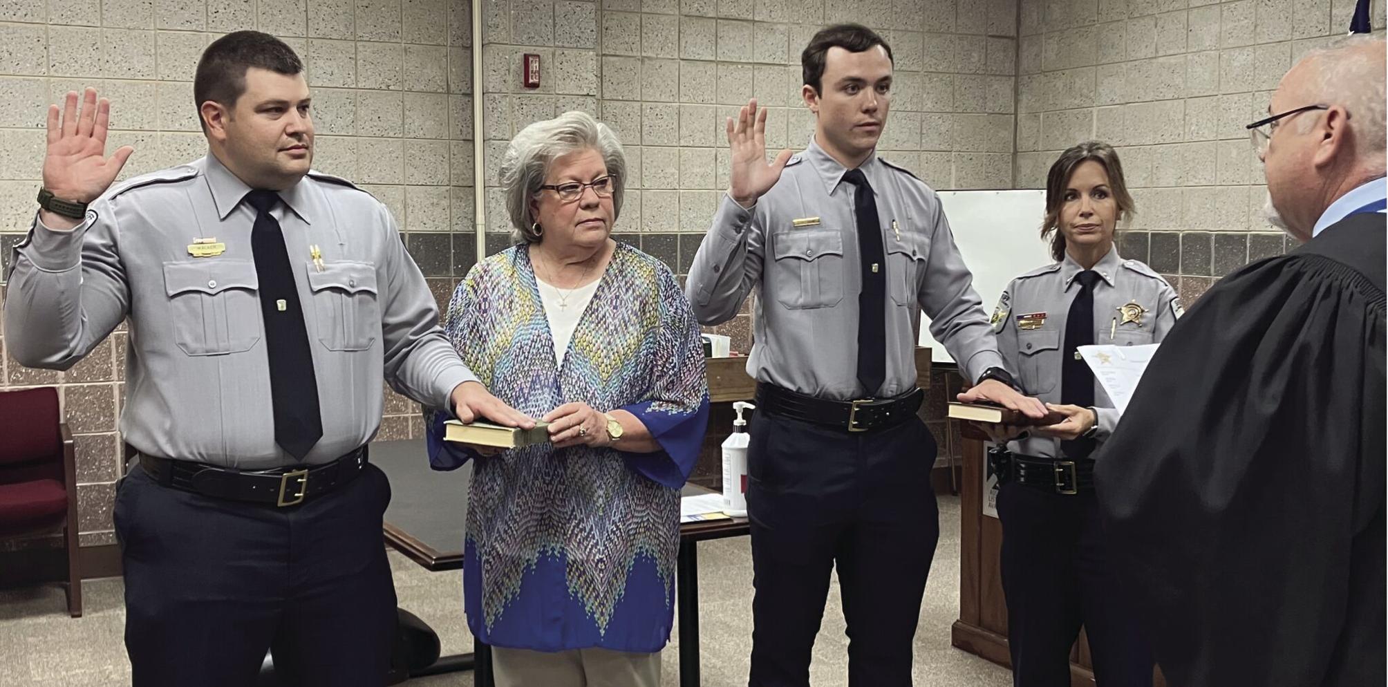 Proud moms hold Bibles as sons become sworn Deputies and pin on the ...