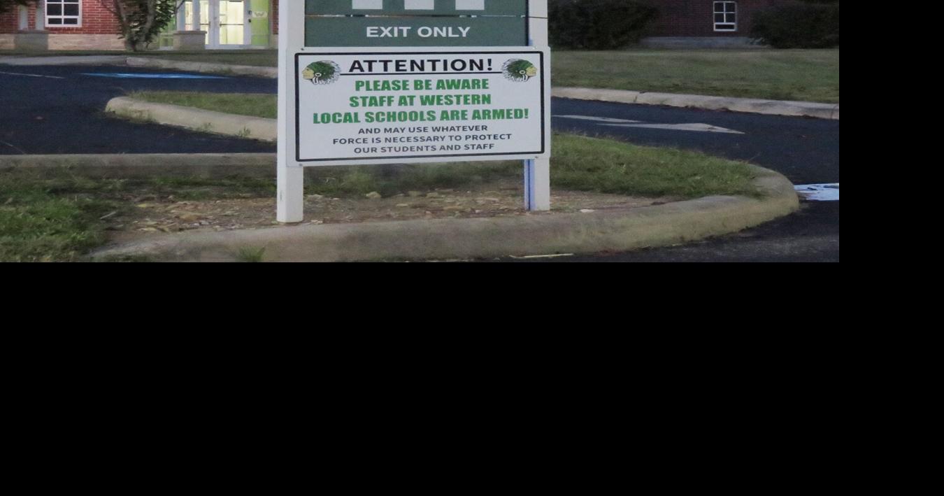 Western armed sign 8728.jpg | | newswatchman.com