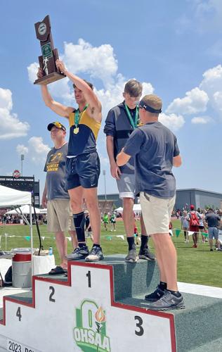 Cole Miller hoist trophy 0044.jpg | | newswatchman.com