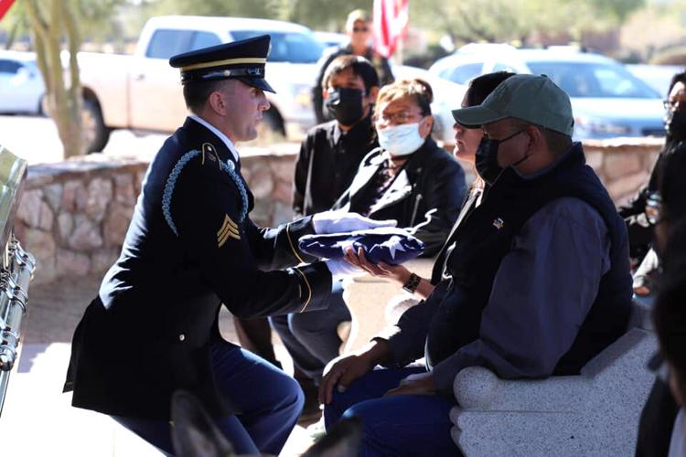 Family of U.S. Army veteran Brian Yazzie receive Navajo and U.S. flags ...