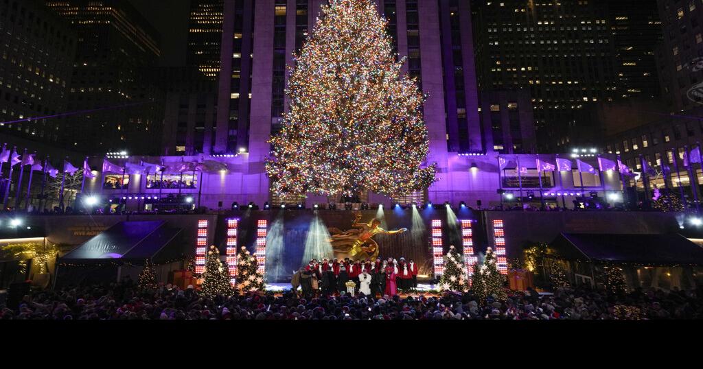 Iconic Christmas tree at Rockefeller Center illuminated in midst of pro ...