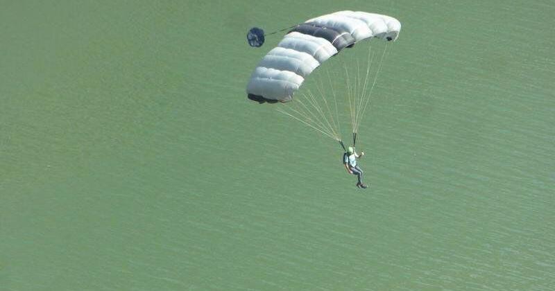 On the road: Base jumpers parachute from lofty Snake River bridge ...