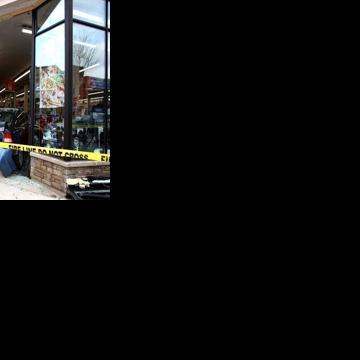 Collision sends car through storefront