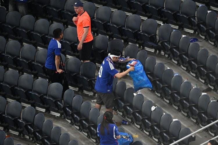 Japan fans use blue bags to uphold a cleansing World Cup tradition ...