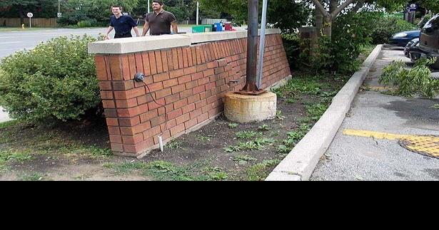 Leaning Wall of Tim Hortons set for repair