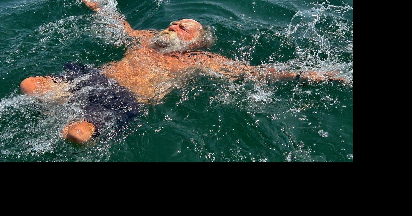 Double-amputee challenges himself to swim across canal
