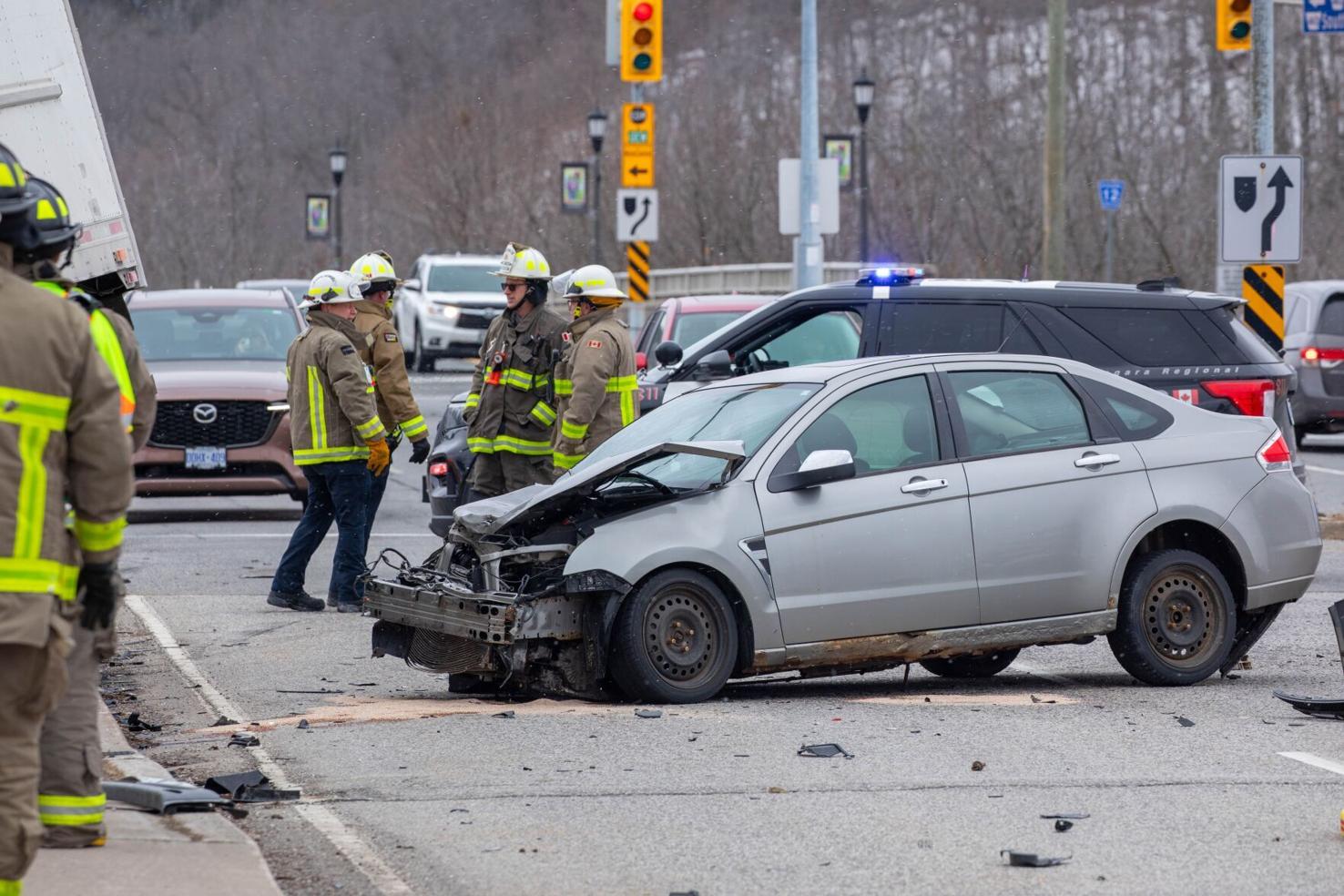 Transport truck hangs from QEW overpass after Grimsby crash