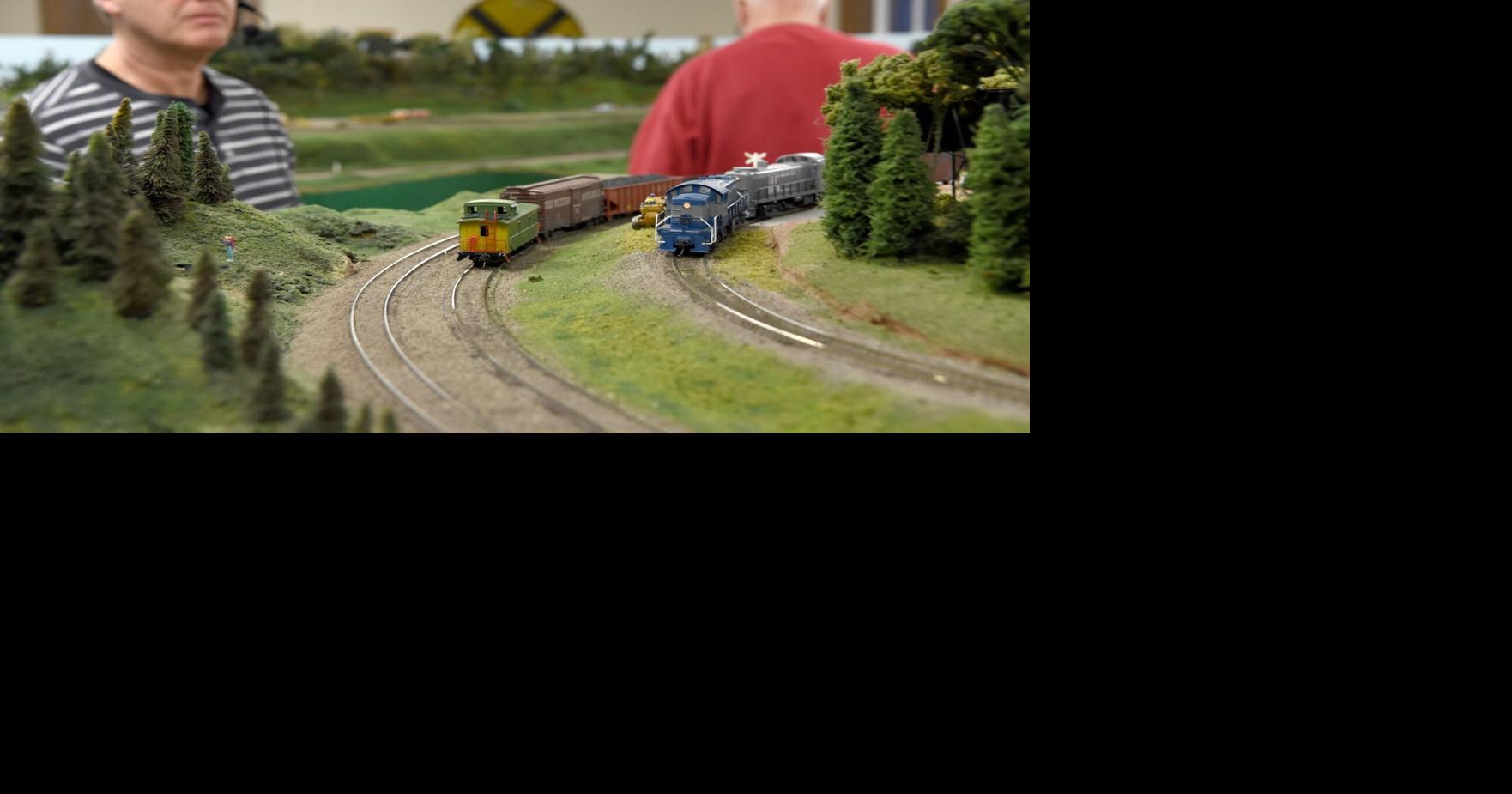 Model railroad engineers keeping the trains on time