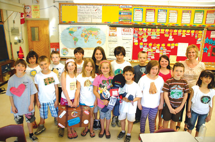 Students give doll identity through good deeds