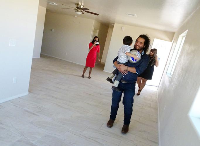 Seven local families collect keys to new homes | Local News ...