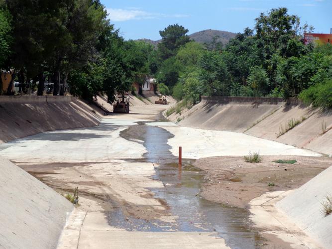 Gains made but work remains to repair Nogales Wash before rains arrive ...