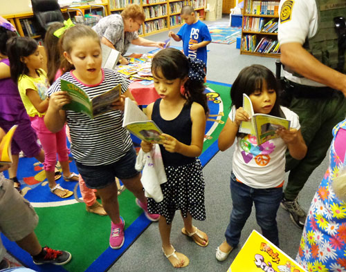 Book distribution effort encourages kids to read | Community ...