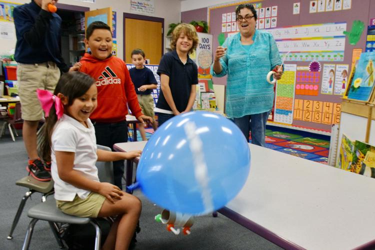 High school students help make science fun at Bracker | Community ...