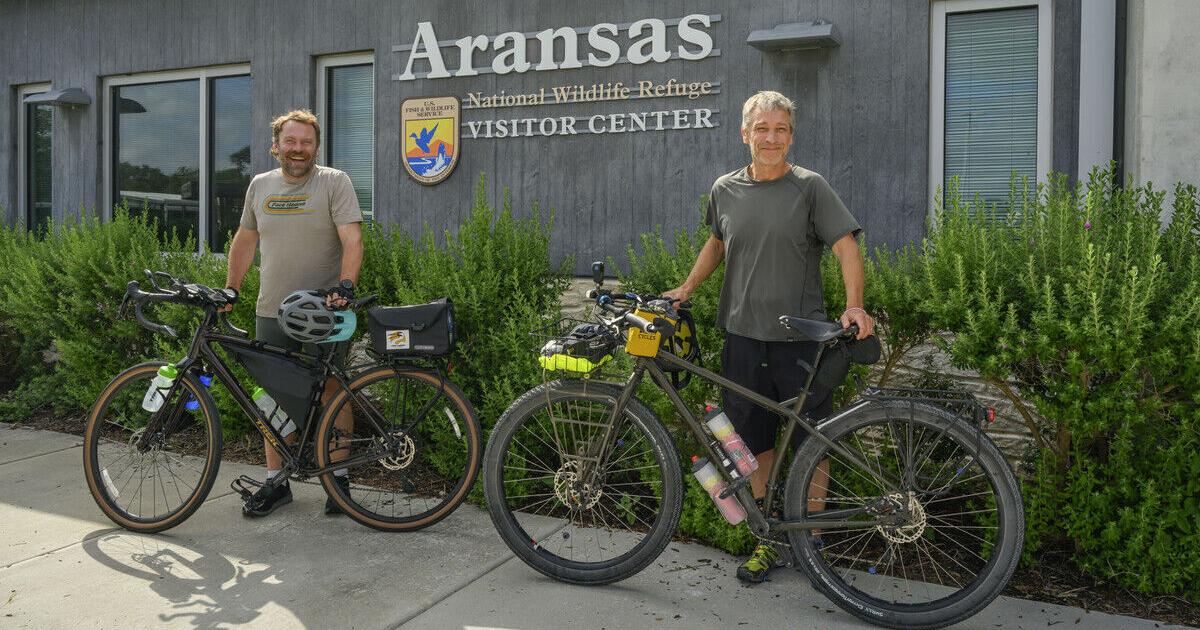 Husker duo bikes Whooper Highway to spotlight cranes