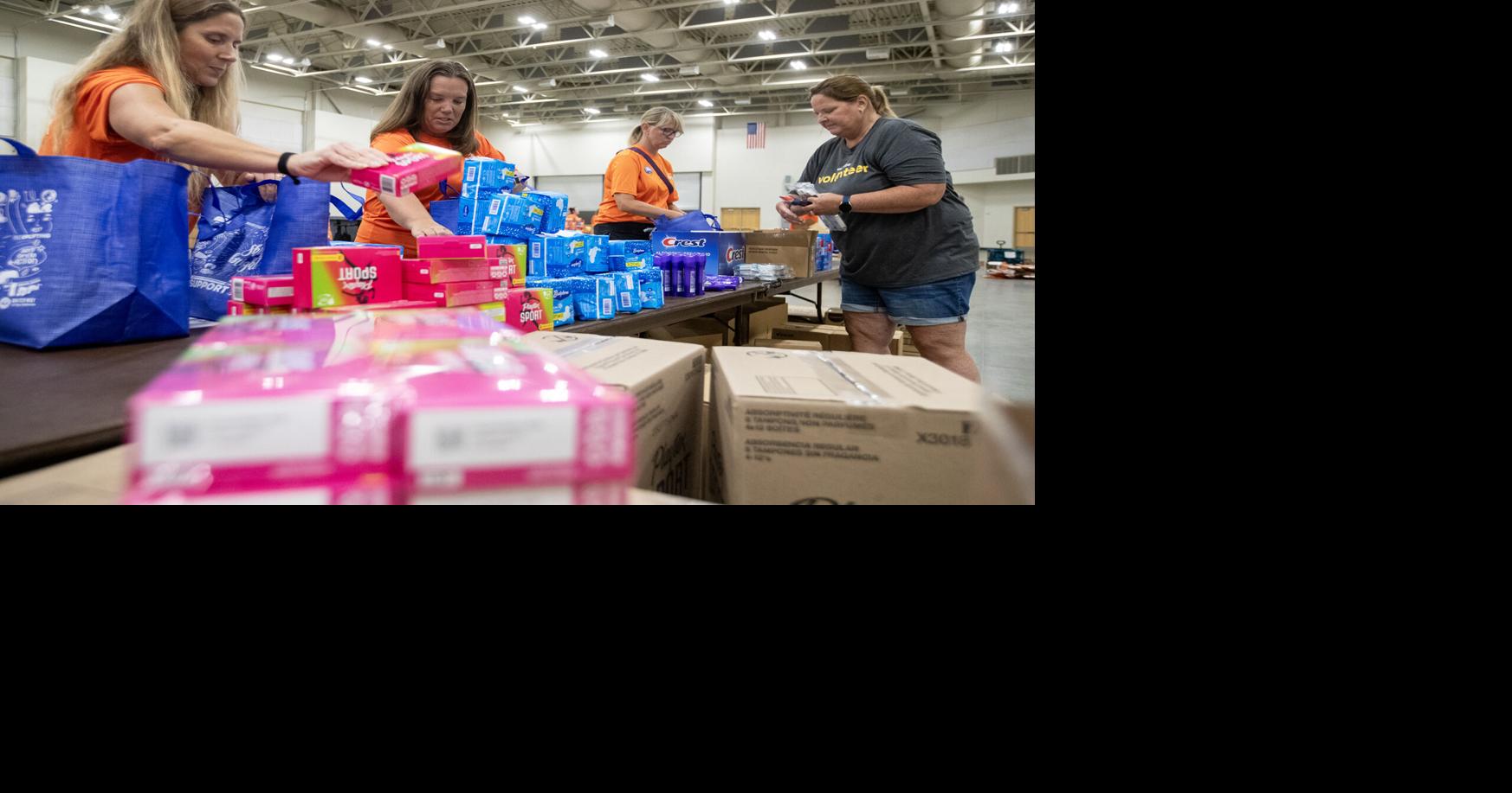 Volunteers gather to assemble hygiene kits for students