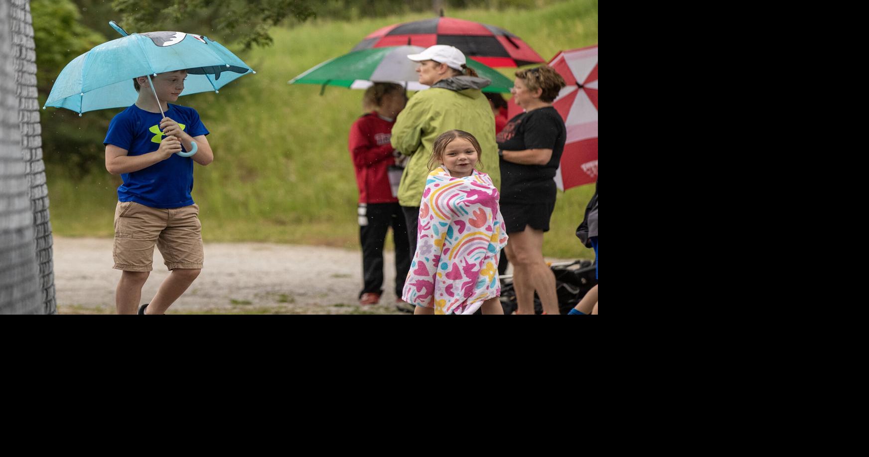 PHOTOS & VIDEO: Rain delays area games, but a welcome sight following ...