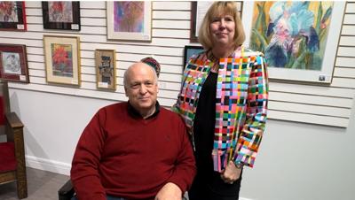 Keith and Holly Howe, owners of Photographic Images, display gallery ...