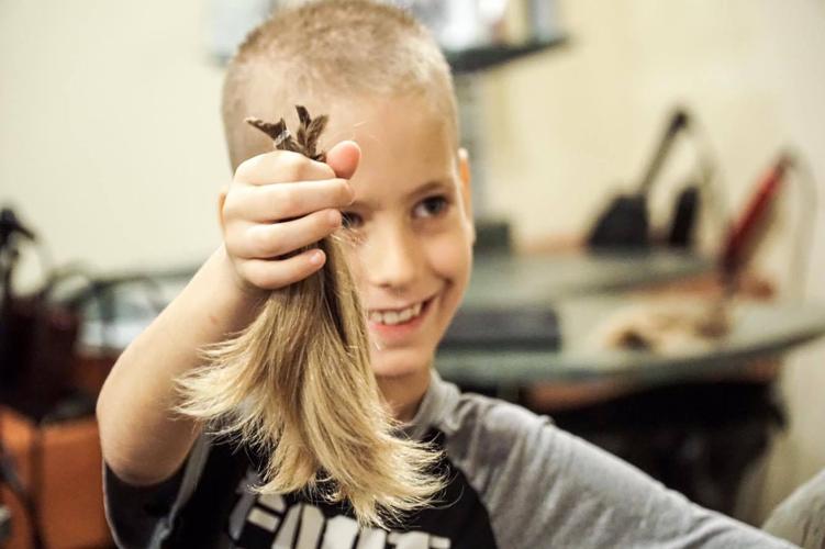 Mentor motivates two brothers to help children with cancer