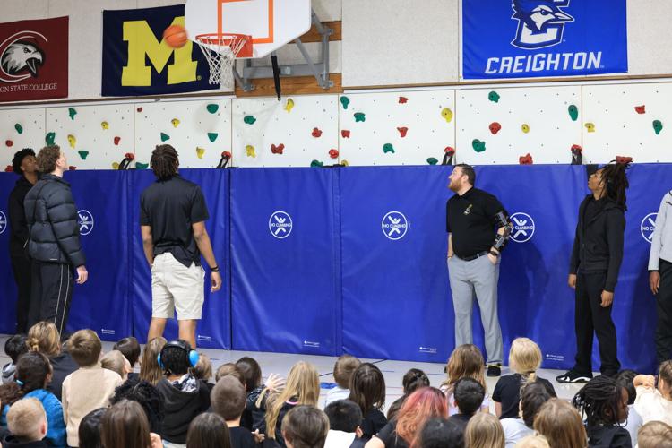 NPCC men's basketball players help Jefferson Elementary celebrate quarter