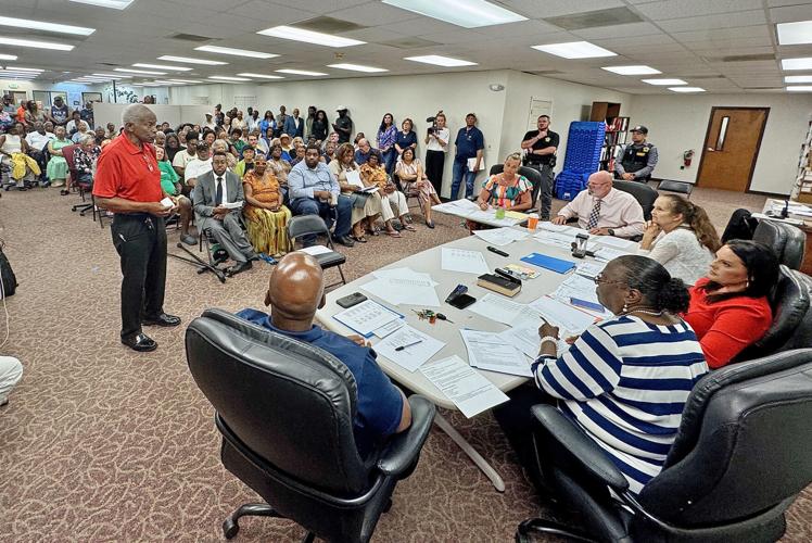 Crowd urges elections board to keep all five early voting sites | News ...