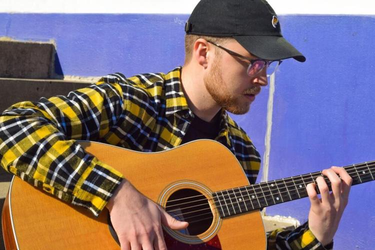 Music is more than sound for local singer-songwriter Austin Leach ...