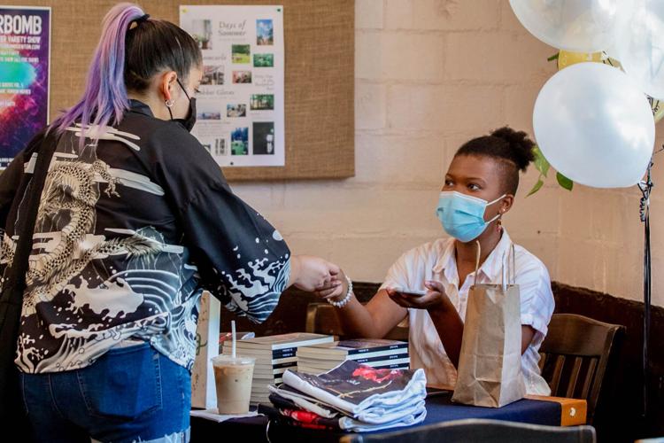 Aura Coffee hosts first book signing for university senior | Arts & Life | ntdaily.com