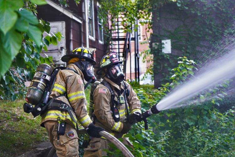 Photos capture region firefighters battling building blaze