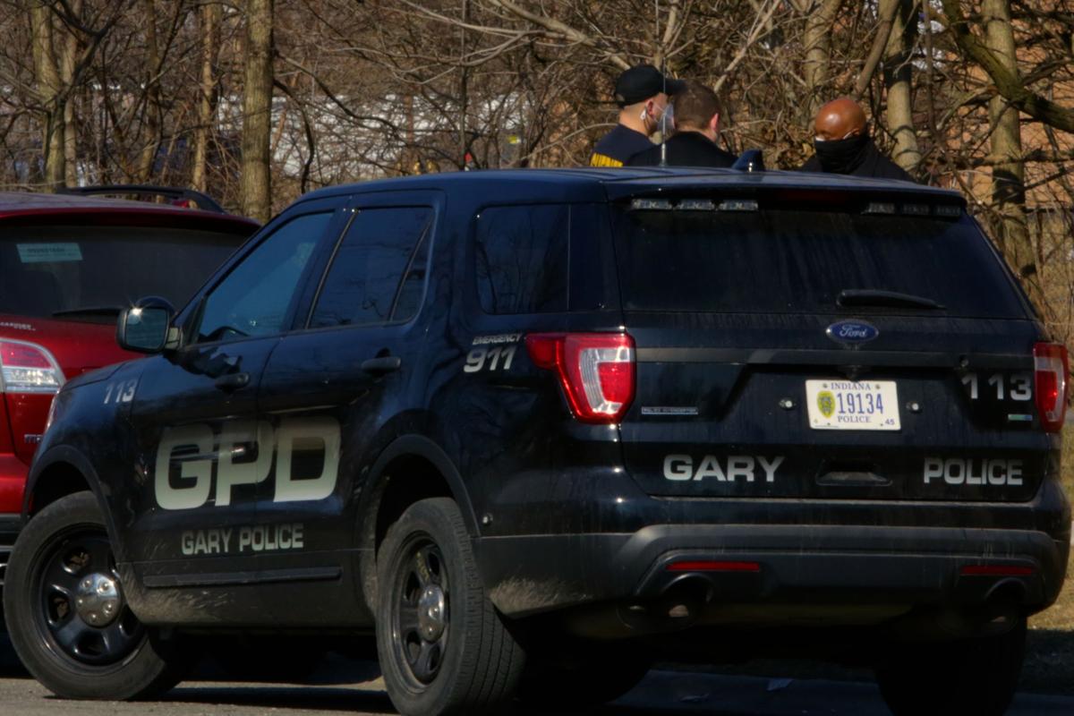 Woman found dead behind wheel of parked car, police say